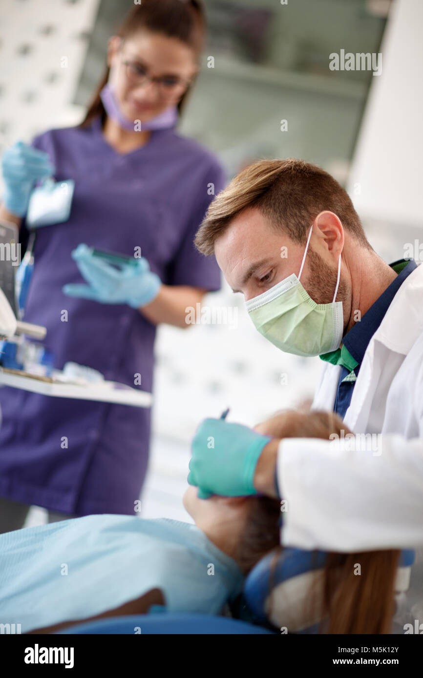 Male dentist at work Stock Photo - Alamy