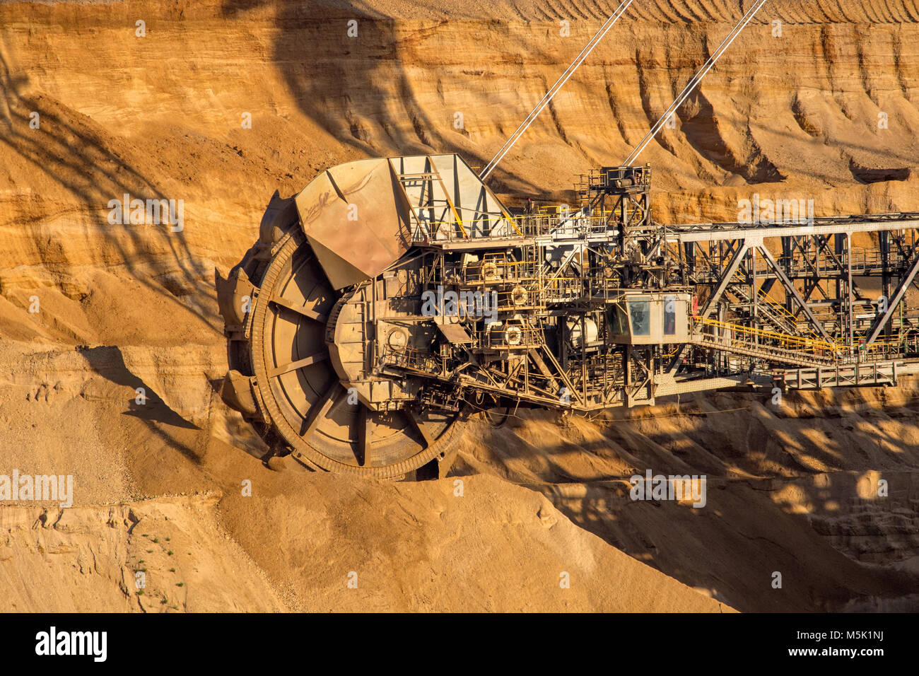 Huge bucket wheel excavator mining for brown coal in an open pit mine ...