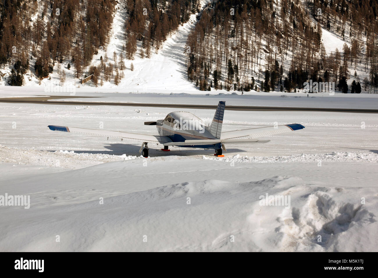 Private jets, airplanes and propeller type aircrafts in the snowy ...