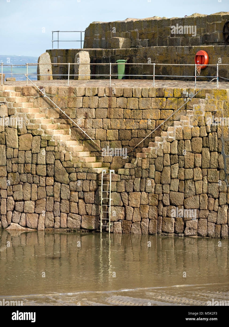 V or Y shaped granite stone steps in Mousehole Harbour wall, Mousehole ...