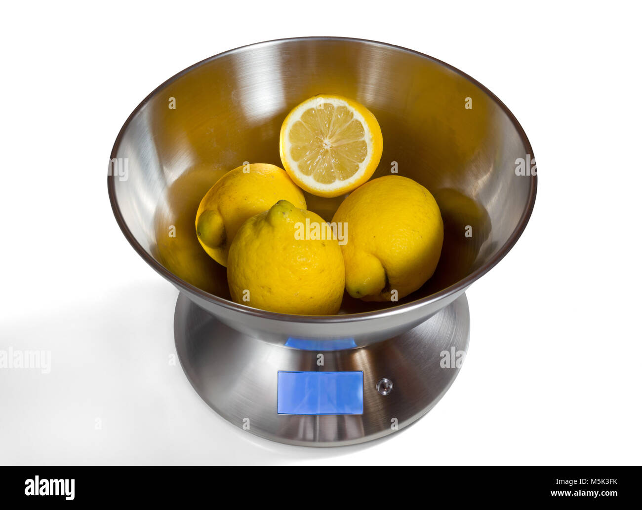 Modern electronic metal kitchen weighing scales with lemons Stock Photo ...
