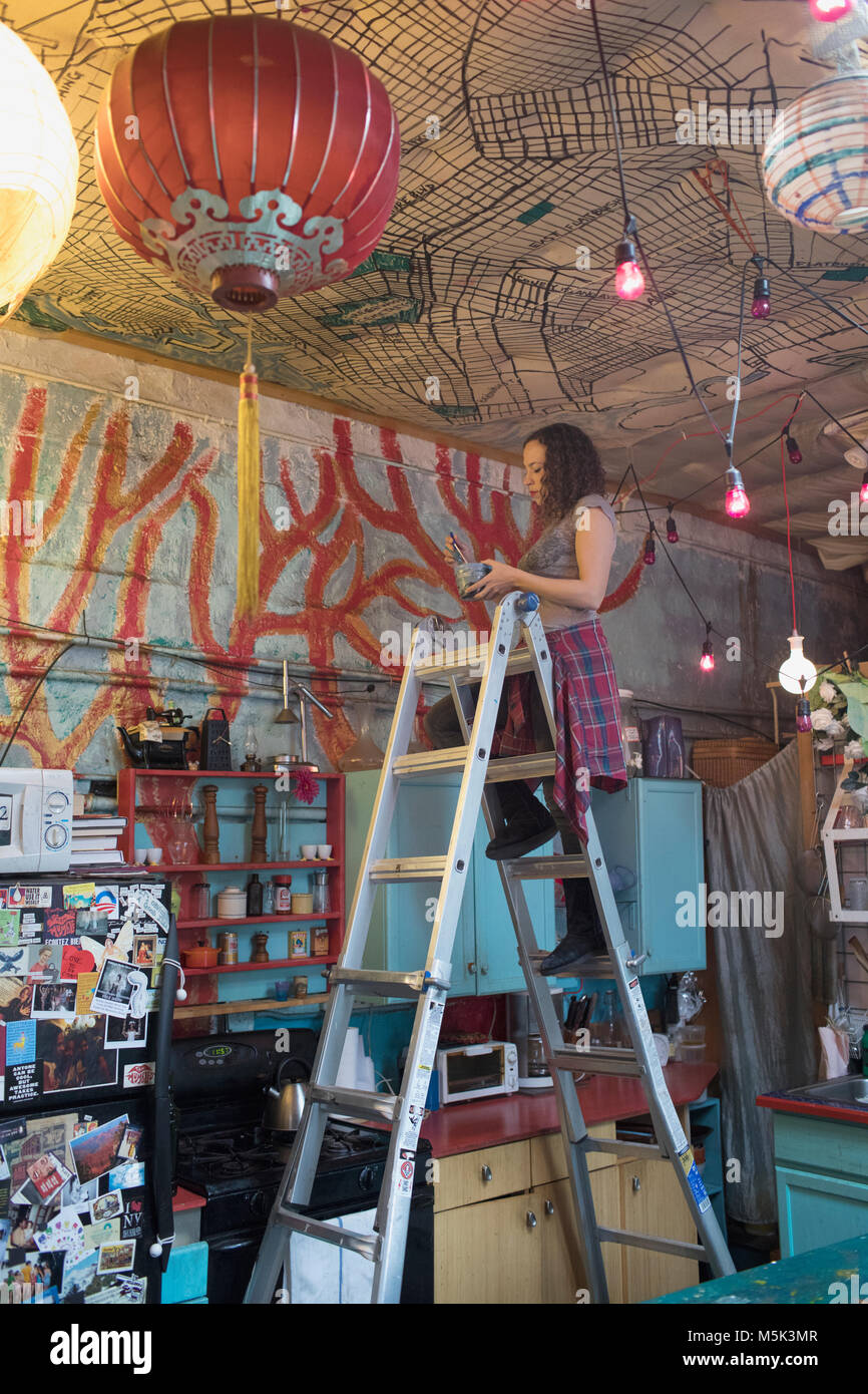 Portrait of young female artist at work Stock Photo - Alamy