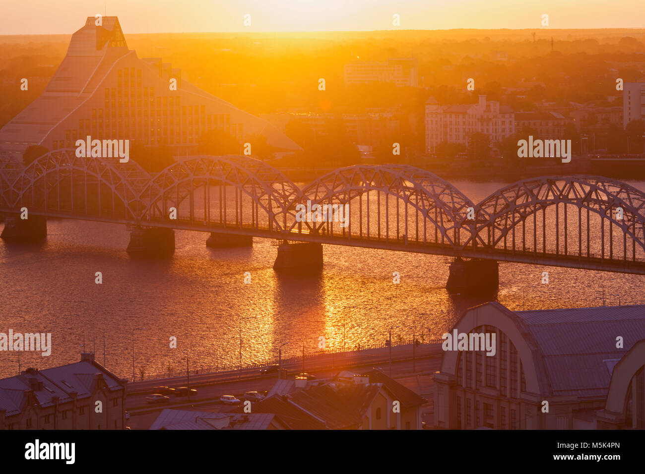Railway Bridge in Riga at sunset. Riga, Latvia Stock Photo - Alamy