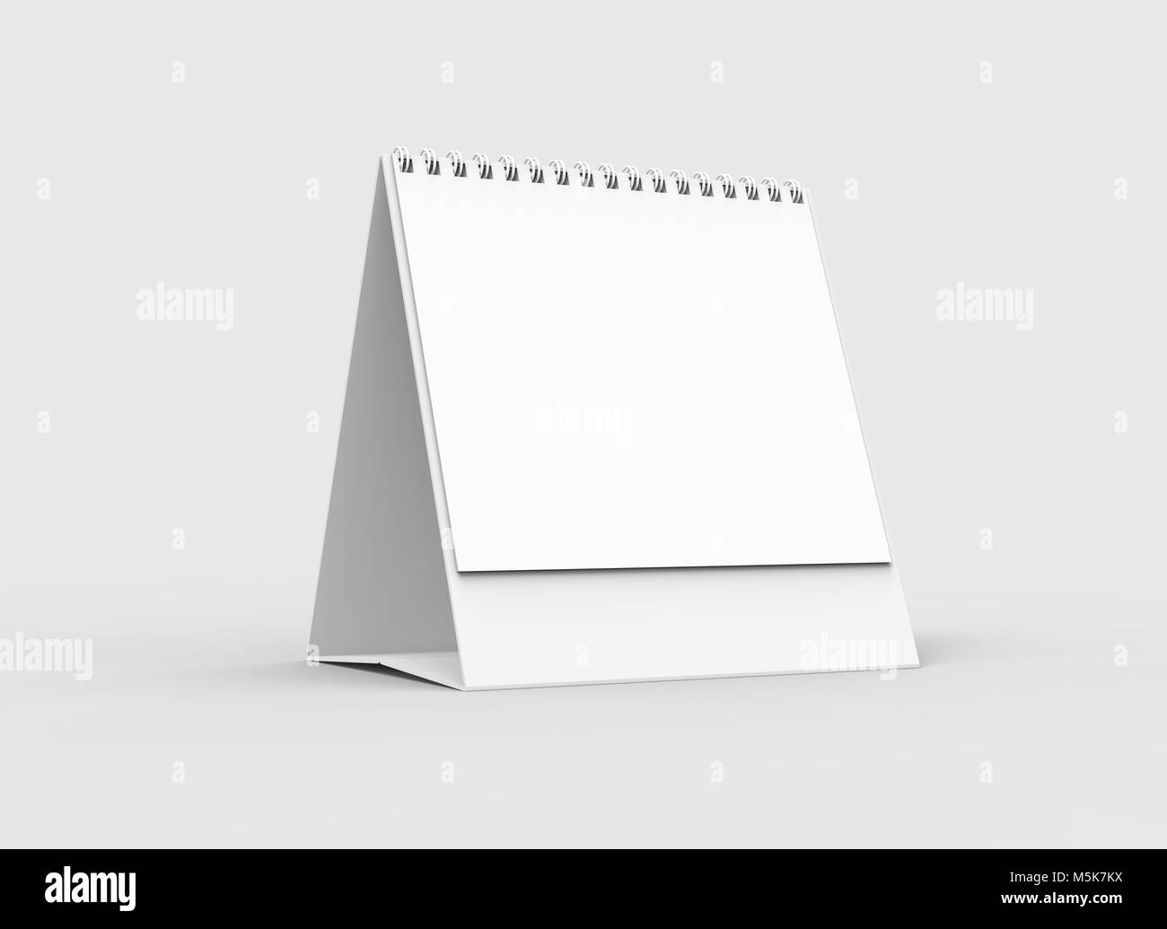 Desktop spiral binding calendar isolated on soft gray background. 3D ...