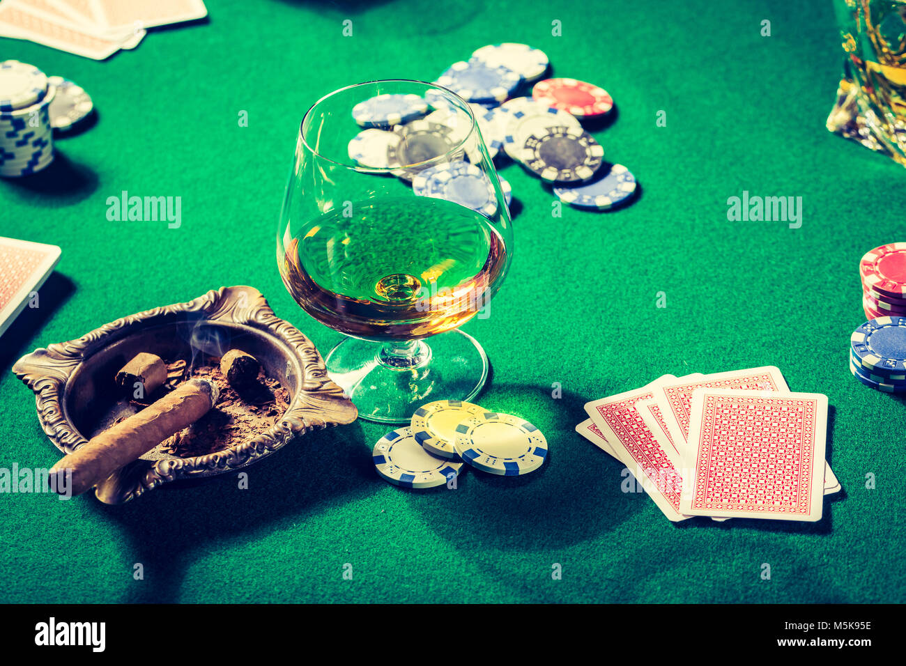 Vintage gambling green table with whiskey, cigar and cards Stock Photo ...