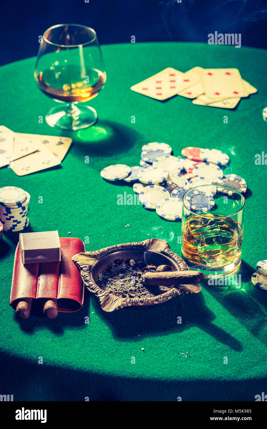Old gambling green table with whiskey, cards and cigar Stock Photo - Alamy