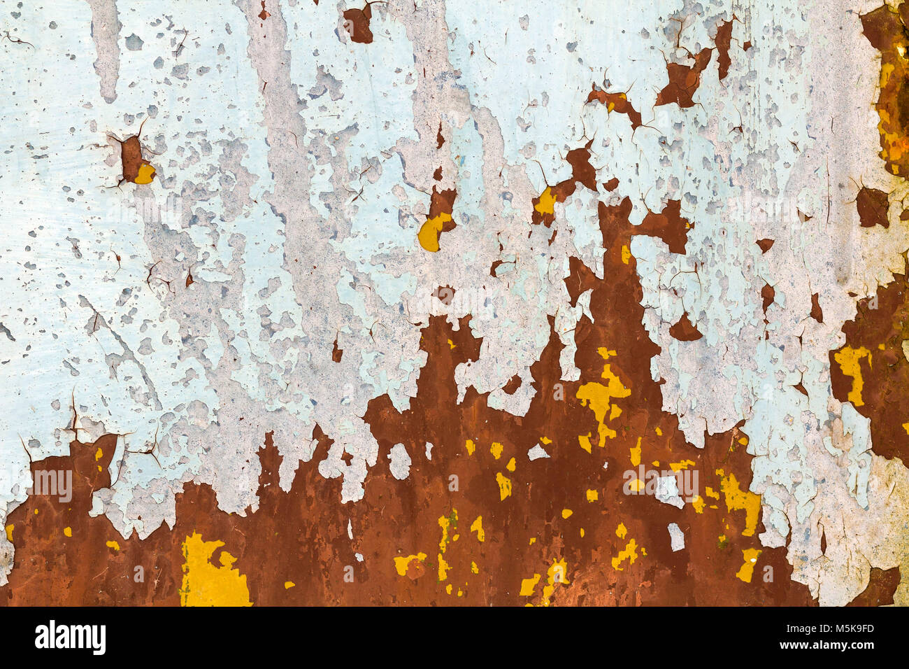 Abstract background texture of vertical grungy rusting metal plate with ...