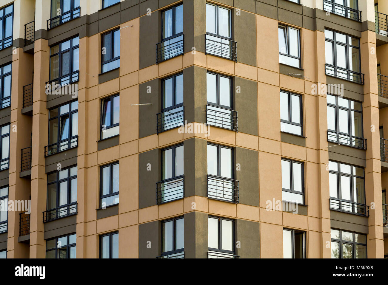 Condominium or modern apartment building with symmetrical architecture ...