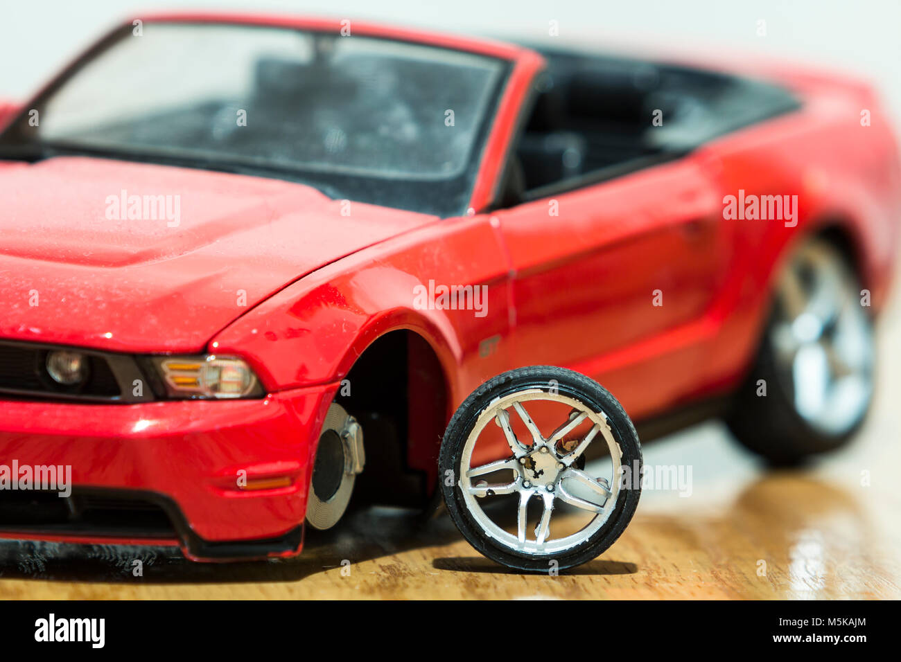 Close-up of rear view of red toy car after road accident Stock Photo ...