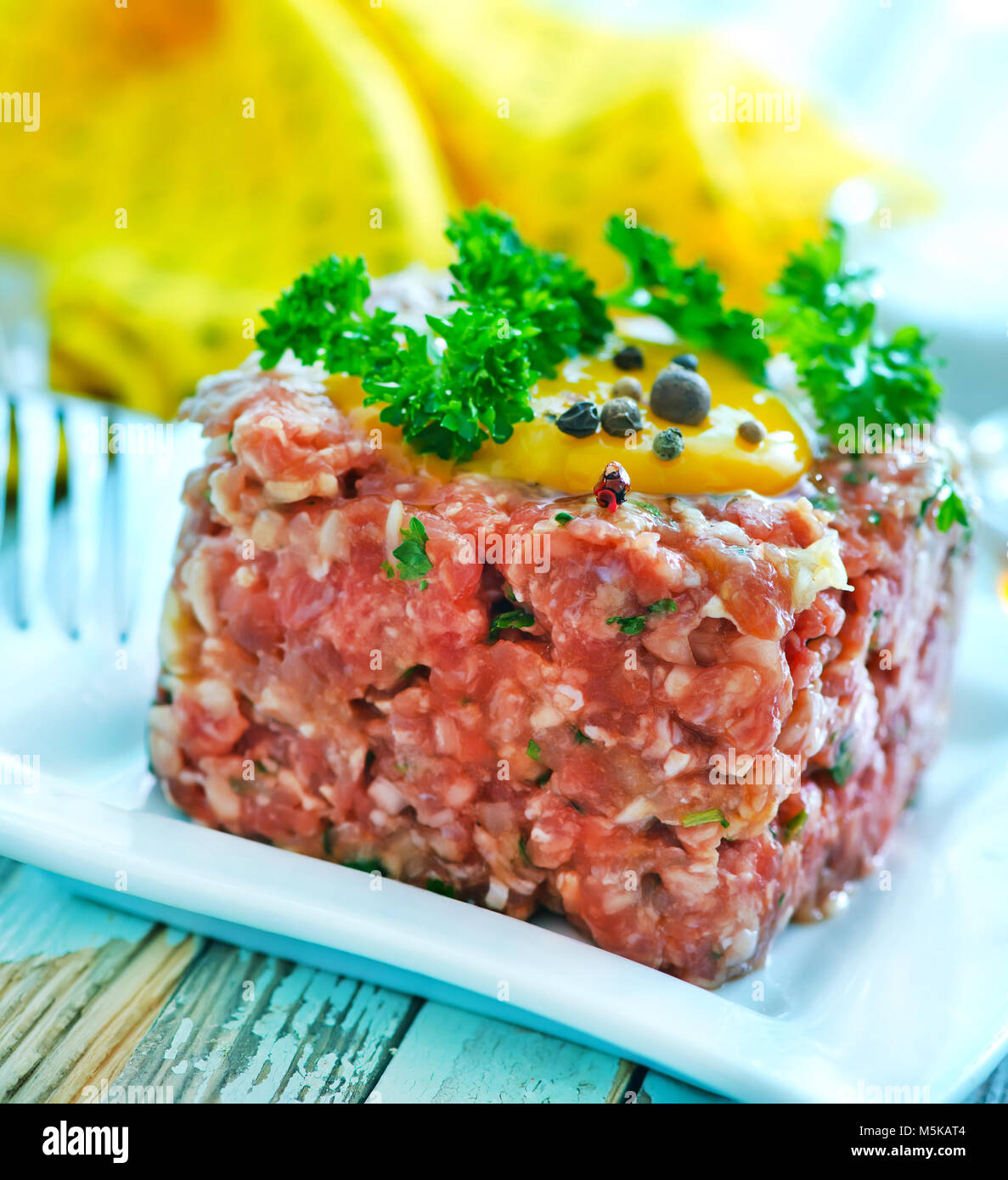 meat tar tar with yolk on the plate Stock Photo - Alamy