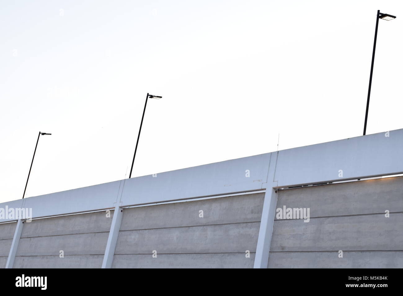Precast concrete structure building and light poles Stock Photo - Alamy