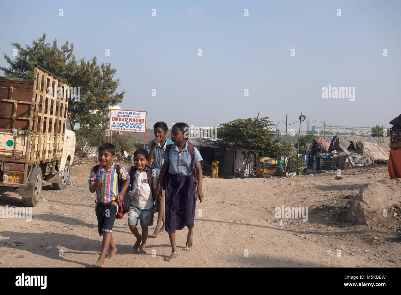 Indian children from poor income neighborhood walking to school ...