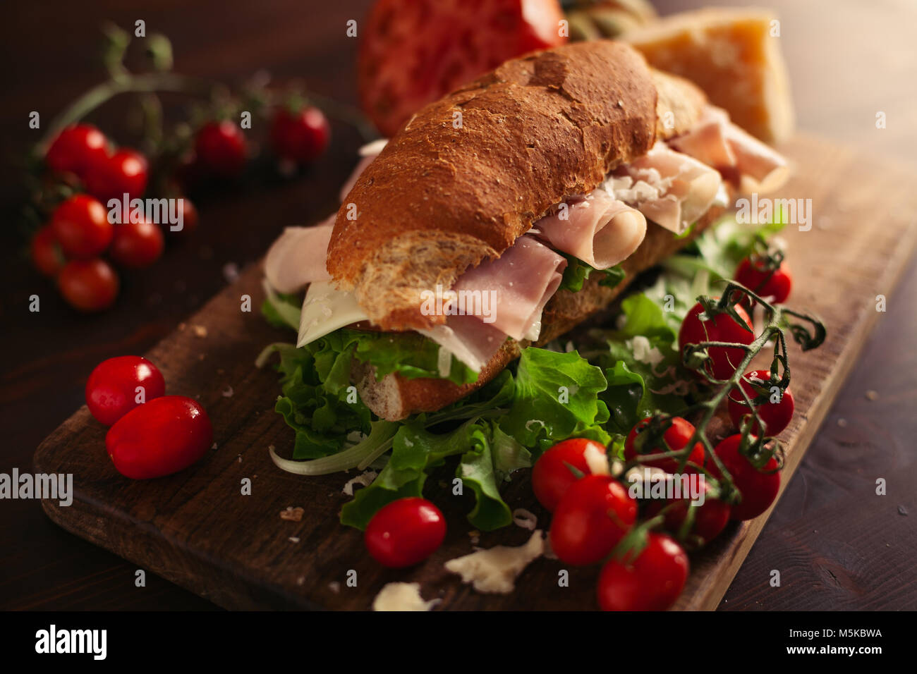 Traditional italian sandwich with cheese, ham, salad, tomatoes and ...