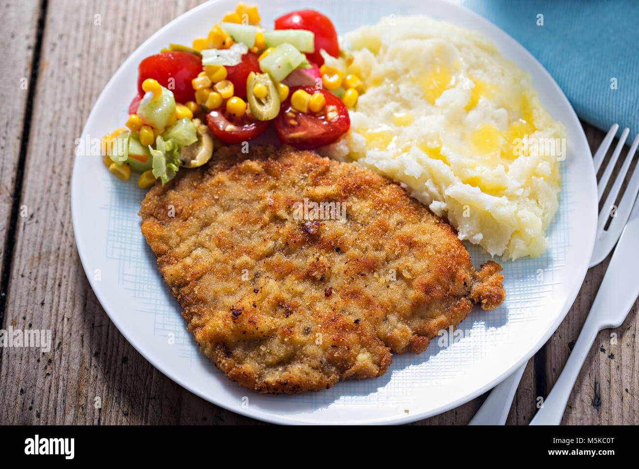 Polish breaded pork cutlet with mashed potatoes and salad Stock Photo ...