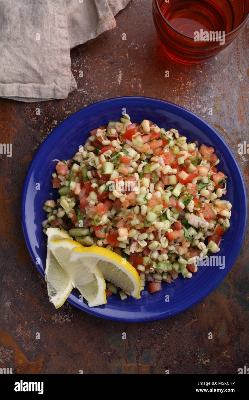 Tabbouleh salad with mung bean sprouts, lemon, and vegetables Stock ...