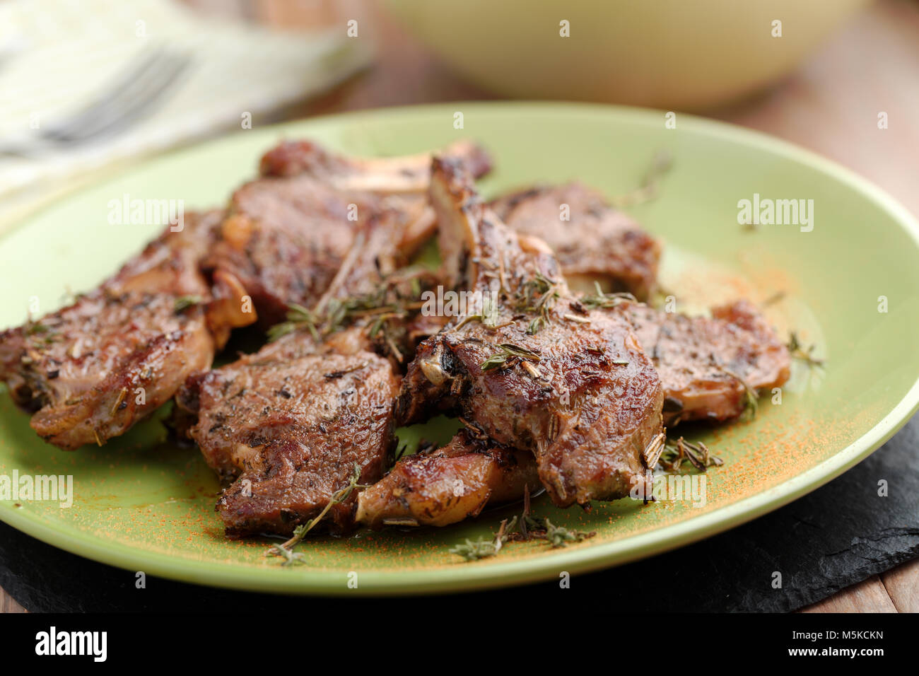 Roasted lamb chops on a plate Stock Photo - Alamy