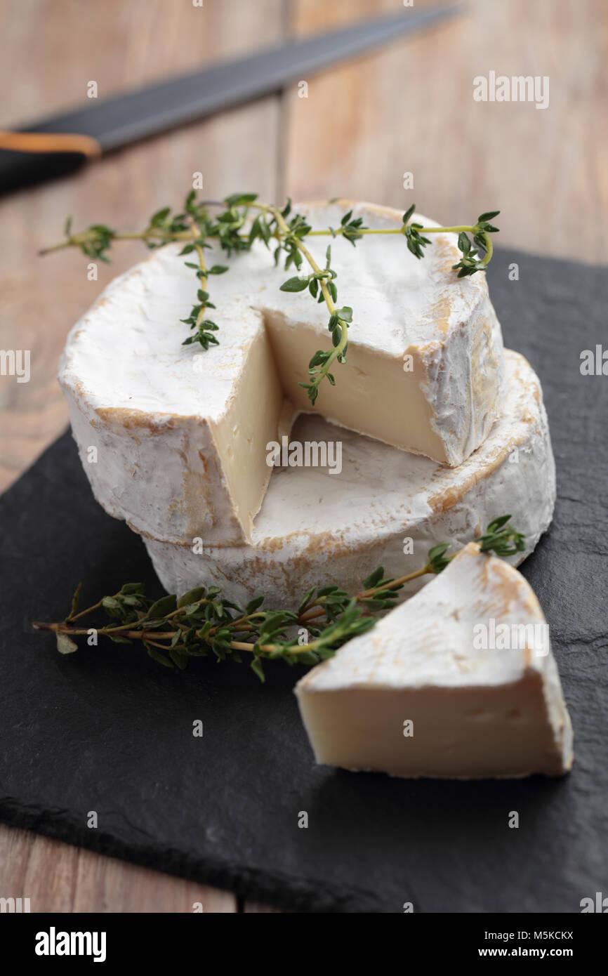 Camembert on a rustic table Stock Photo - Alamy