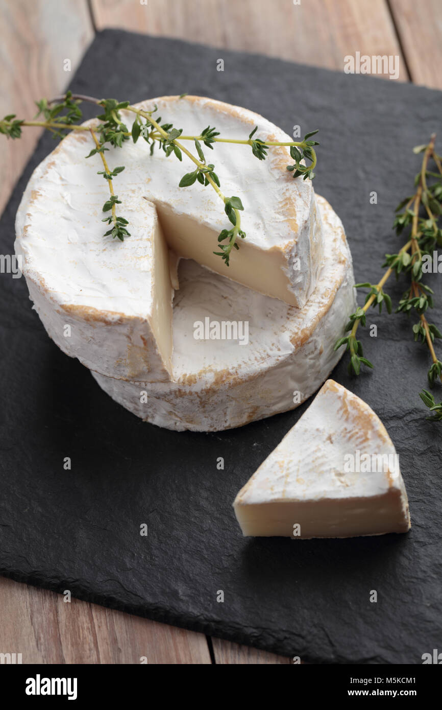 Camembert on a rustic table Stock Photo - Alamy