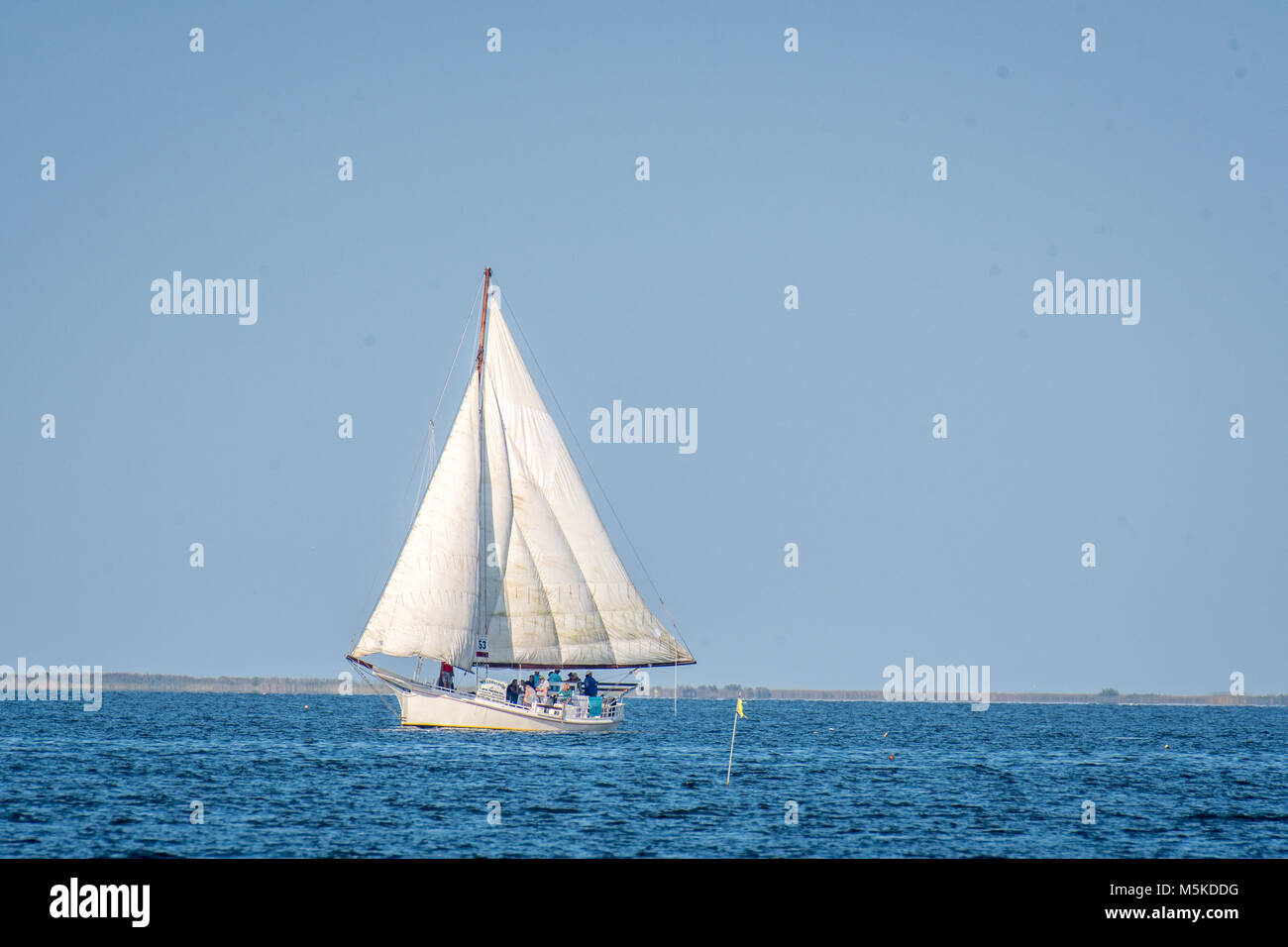 Traditional skipjack boat sailing on the waters of the Chesapeake Bay ...