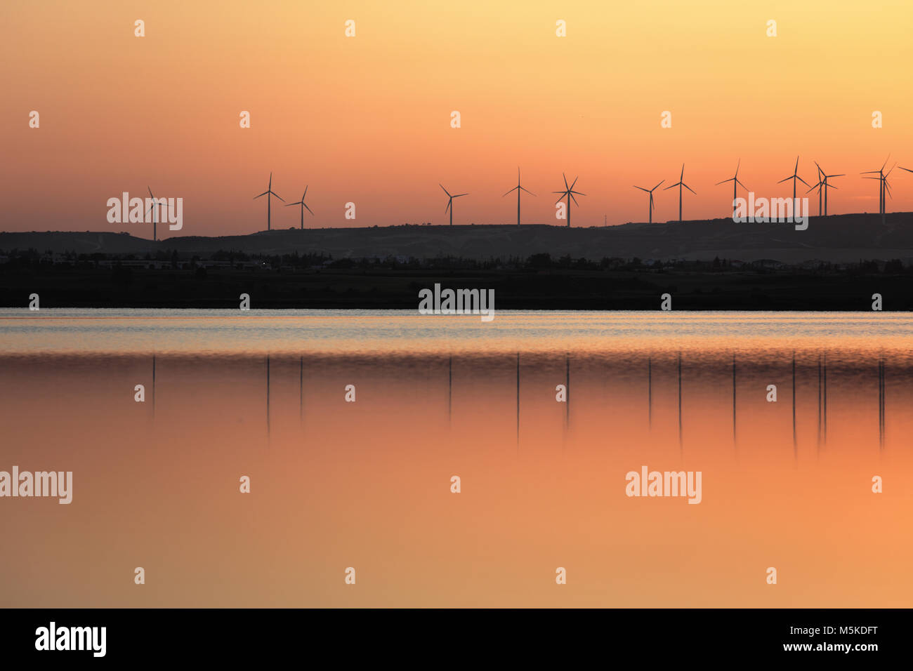 Sunset over the wind farm at Salt lake in Larnaca, Cyprus Stock Photo ...