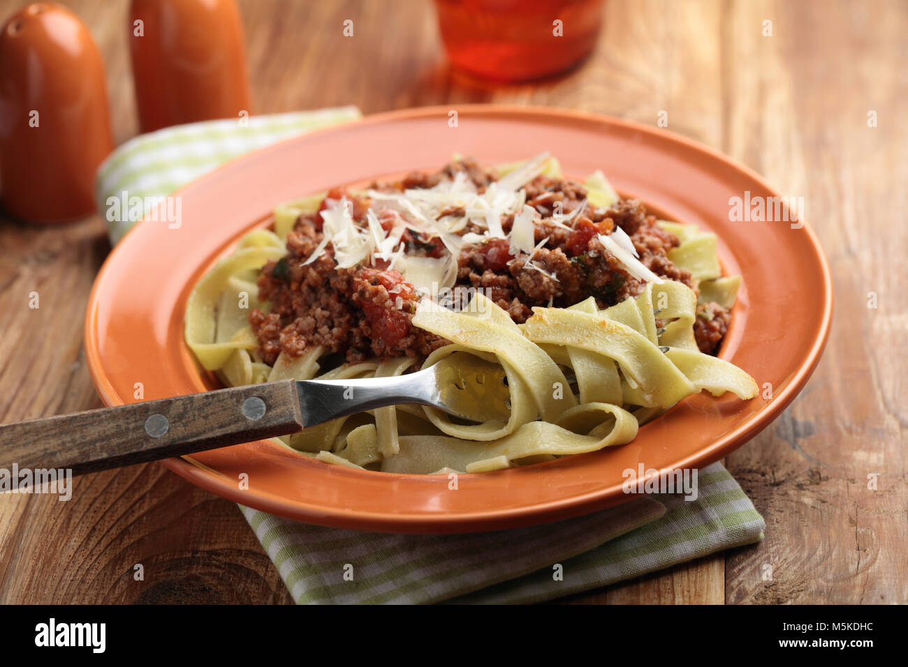 Pasta Bolognese with shredded Parmesan cheese Stock Photo - Alamy