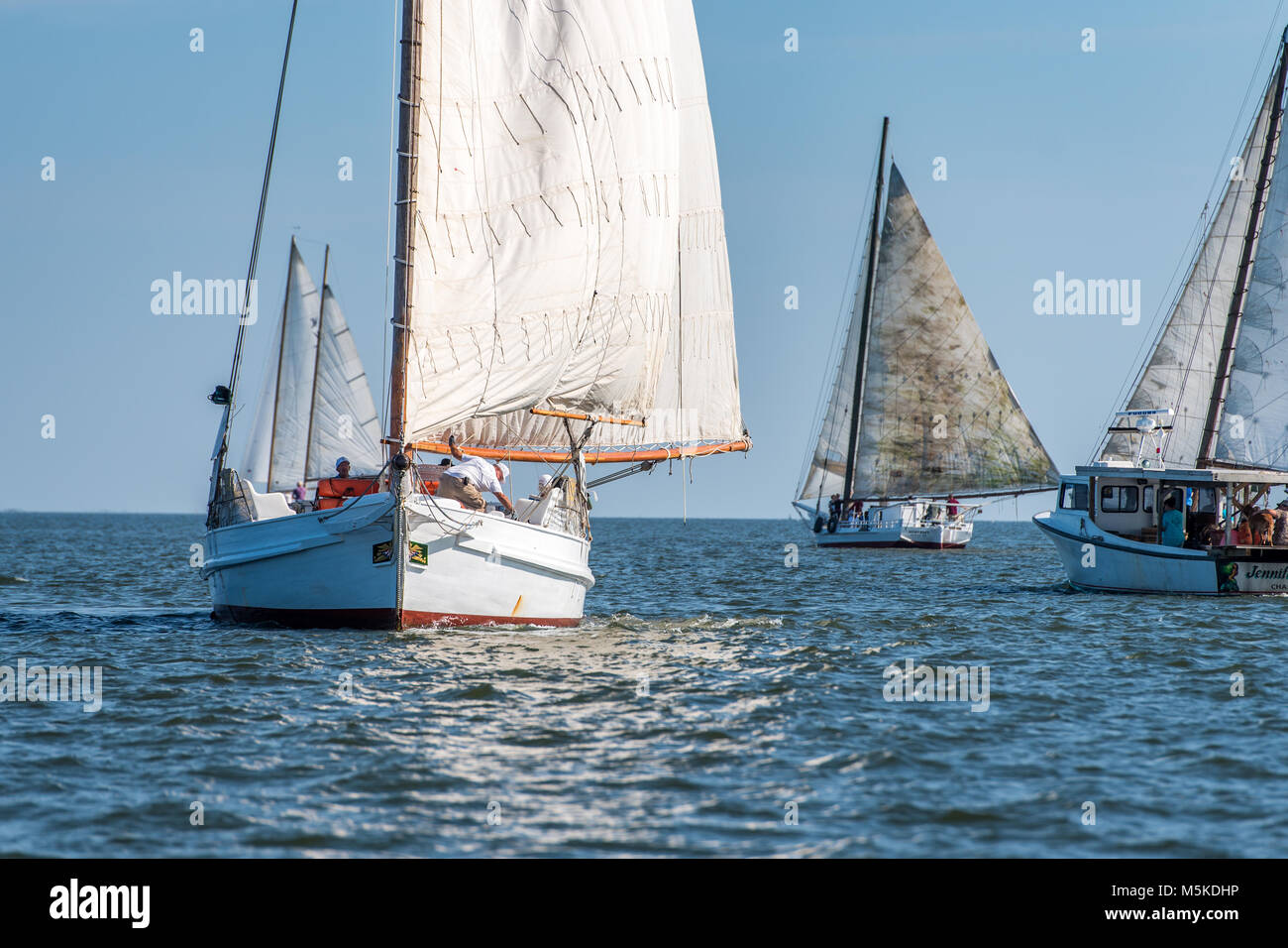 Traditional Skipjack boat cuts through Chesapeake Bay waters with other ...