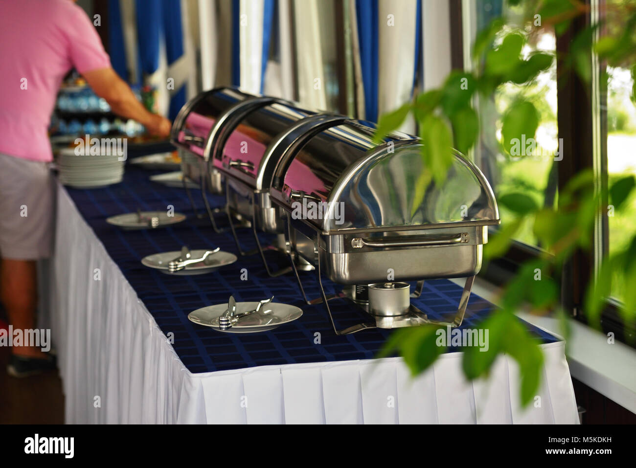 People taking food in a buffet Stock Photo - Alamy