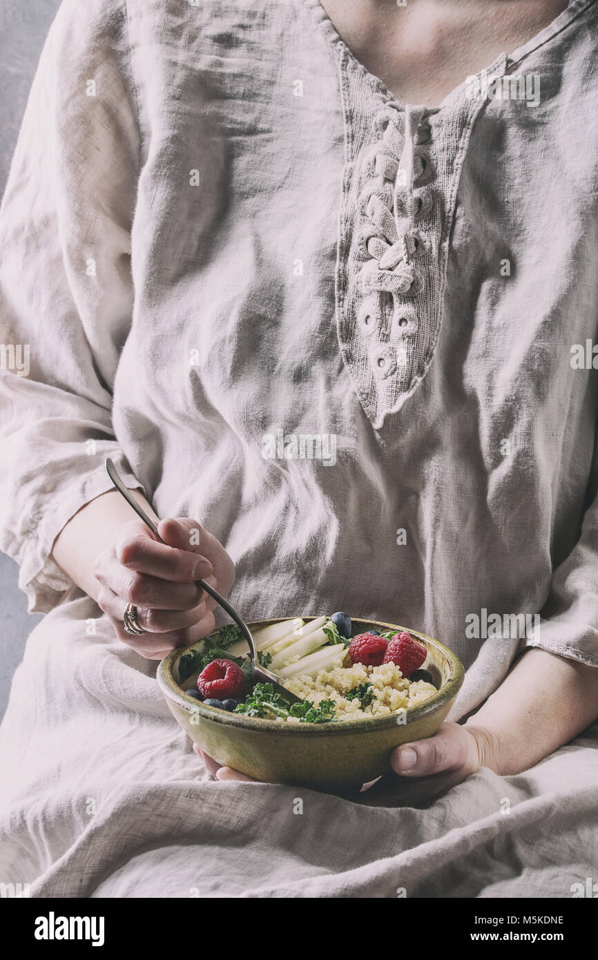 Woman eating tasty quinoa hi-res stock photography and images - Alamy