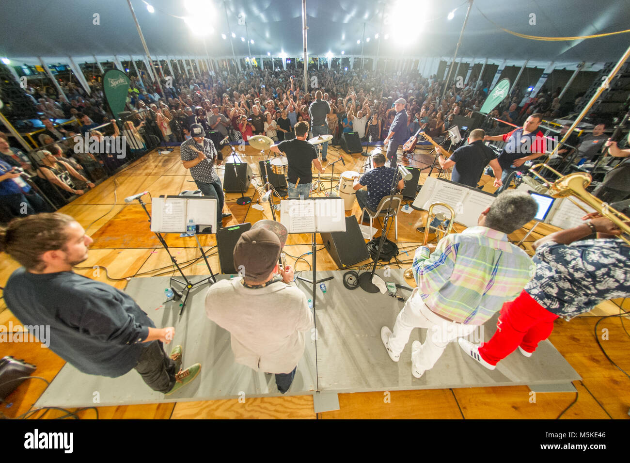 Behind stage as salsa ensemble, Orquesta SCC, energizes large crowd in ...