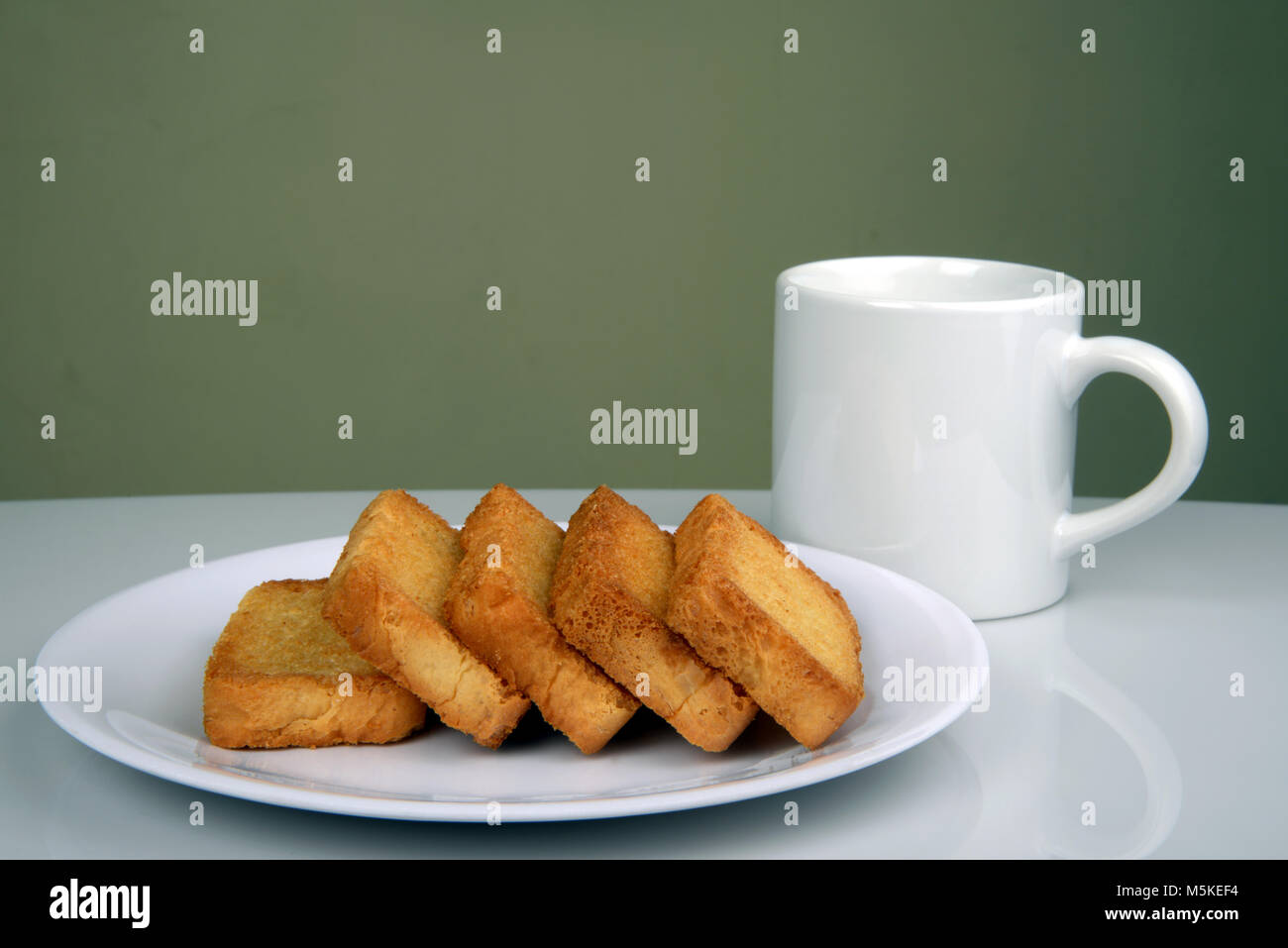 Sweet and crispy toast or rusk with coffee mug Stock Photo - Alamy