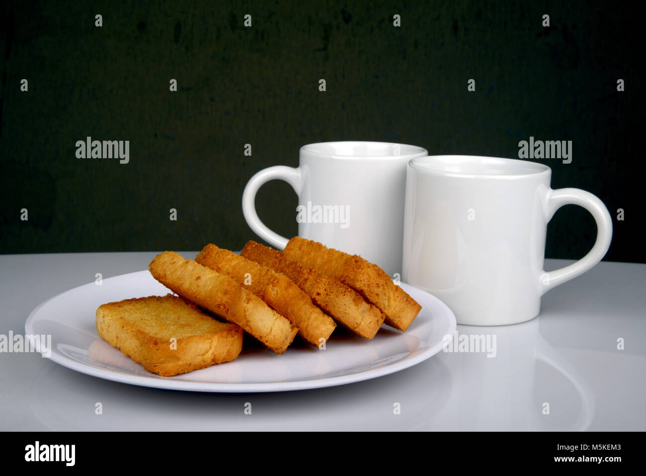 Sweet and Crispy Toast or Rusk With Coffee Mugs Stock Photo - Alamy