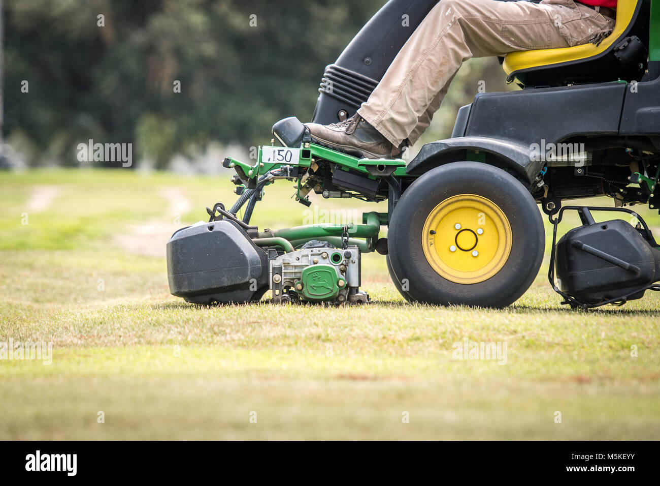Man using lawn mower hi-res stock photography and images - Alamy
