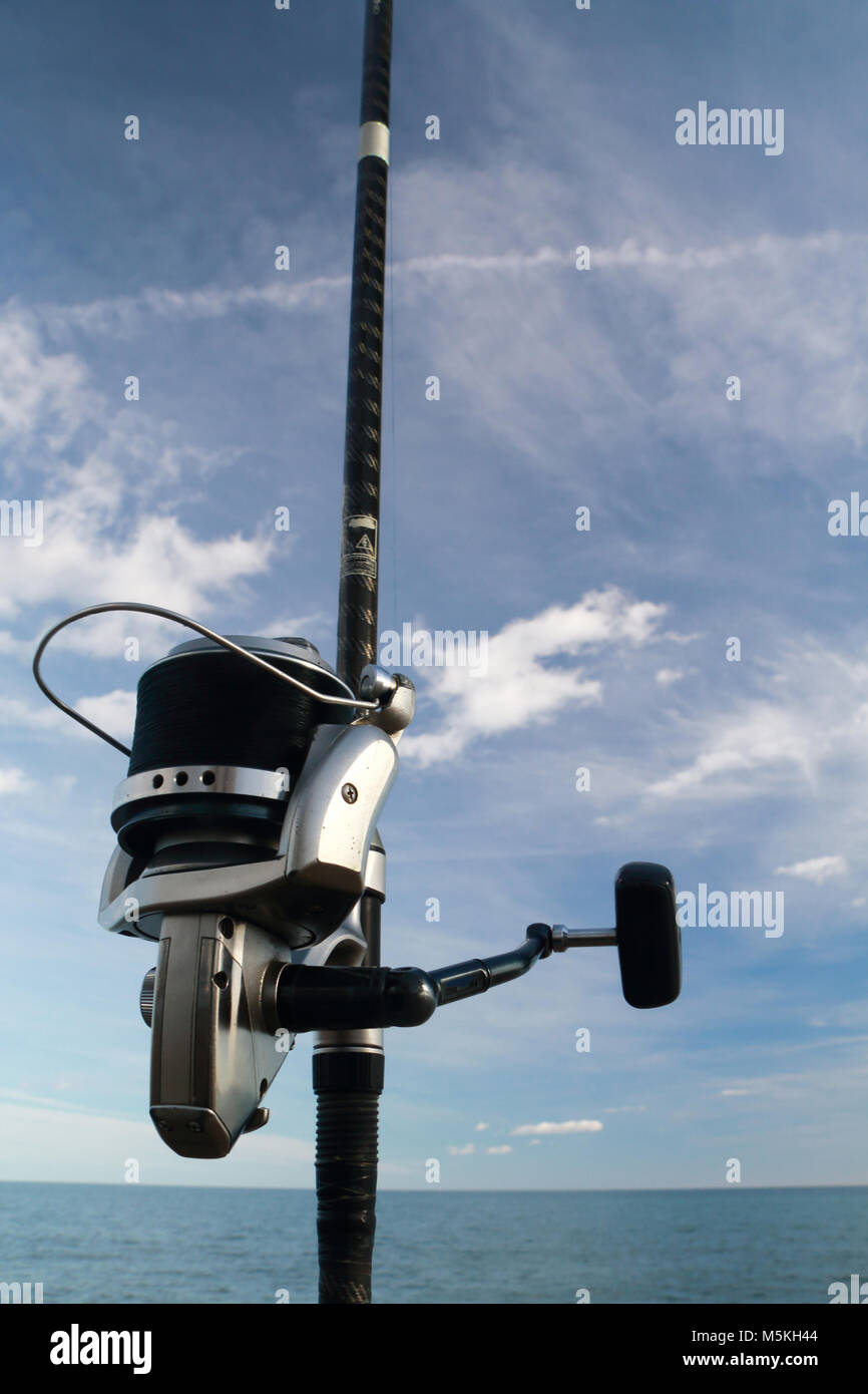 Detail of the reel of a fishing rod Stock Photo - Alamy