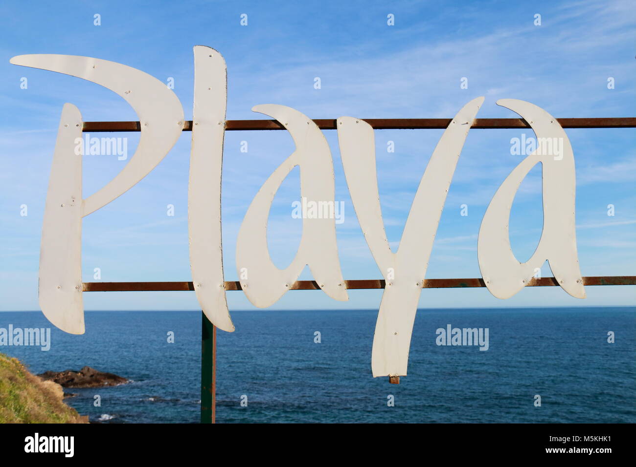 Sign with the word beach written in Spanish: PLAYA, and the sea in the ...