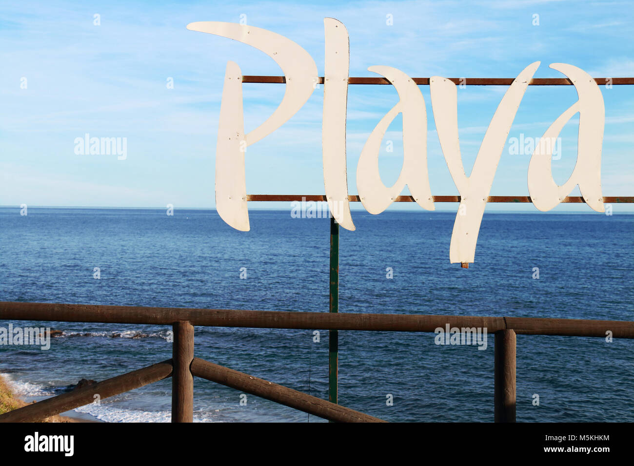 Sign with the word beach written in Spanish: PLAYA, and the sea in the ...