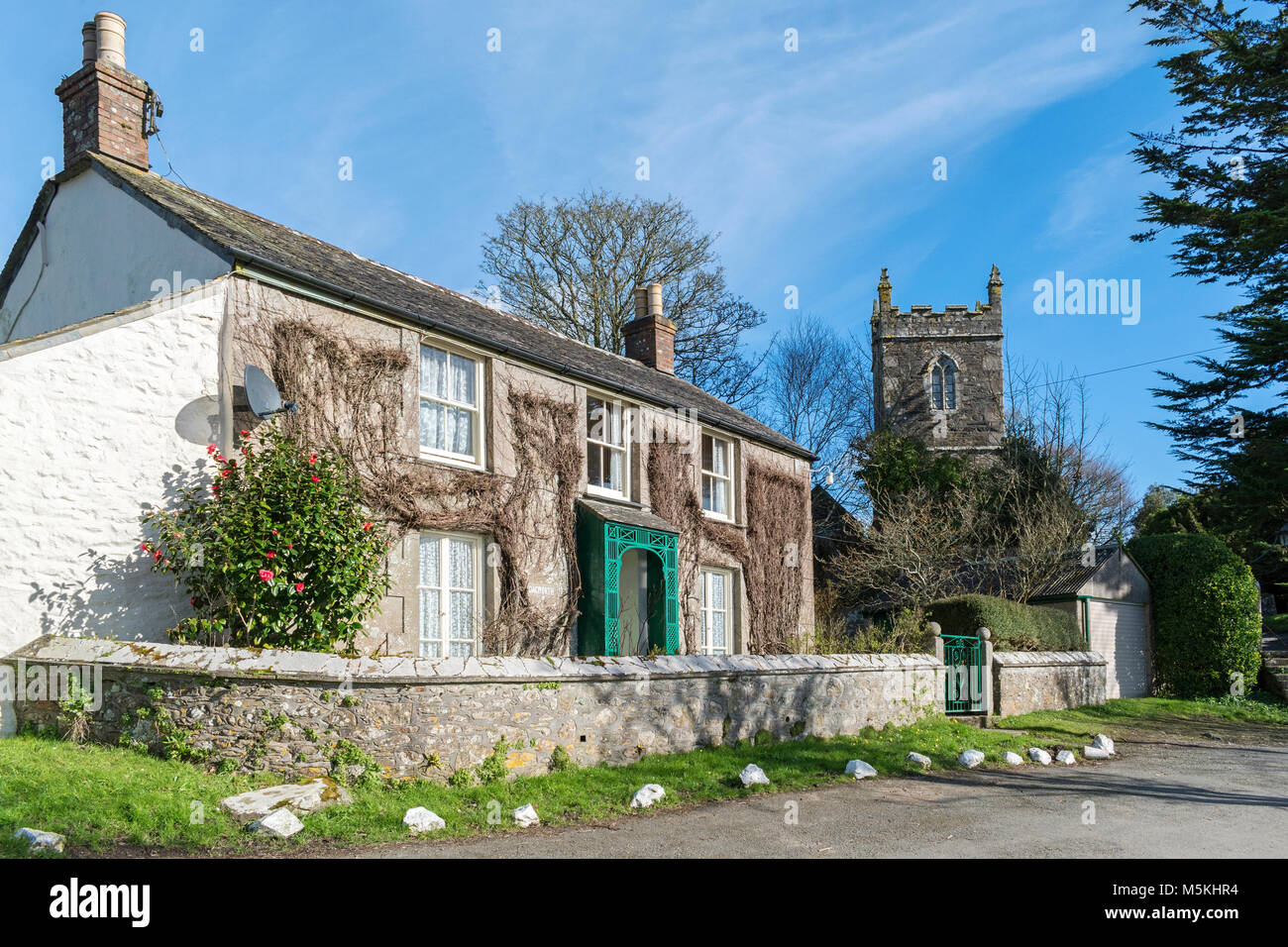 cottage and church in the cornish village of manaccan, cornwall ...