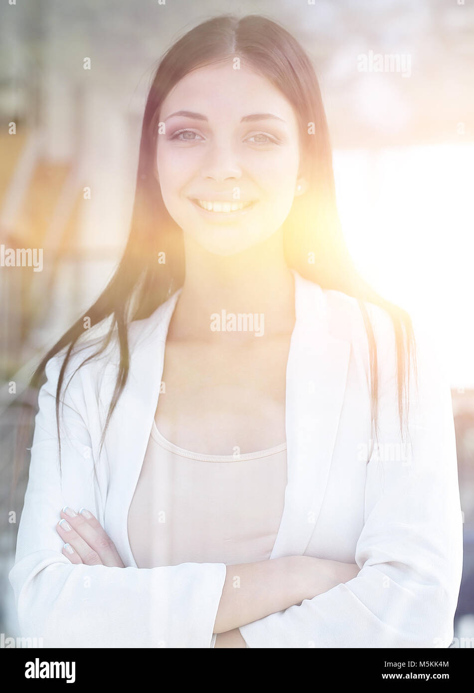 smiling business woman looking out the window Stock Photo - Alamy