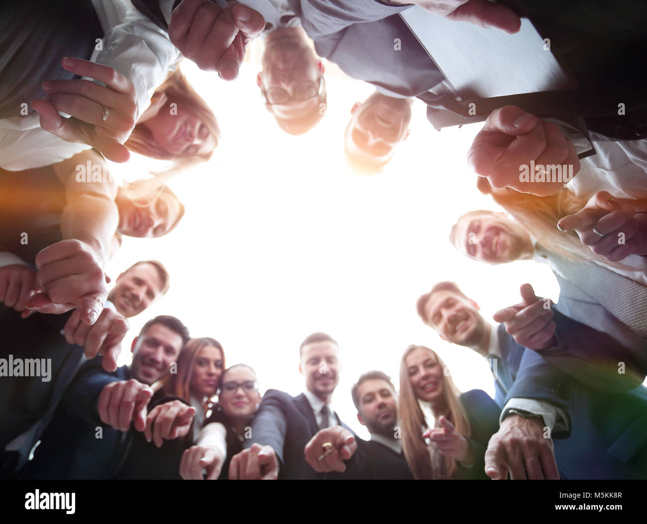 business team is forming a circle and pointing at the camera Stock ...