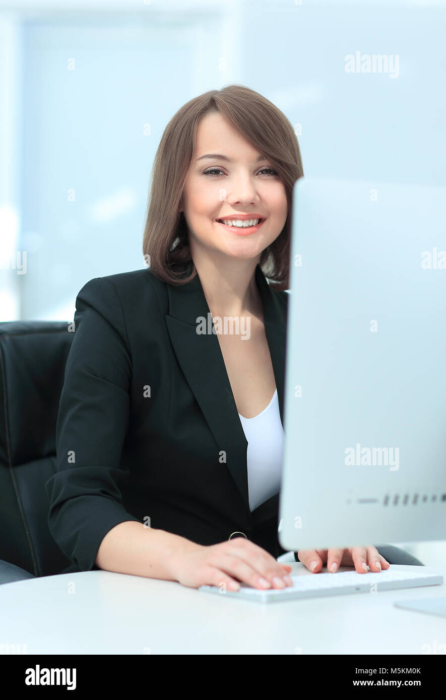 Business woman working with computer in an office Stock Photo - Alamy