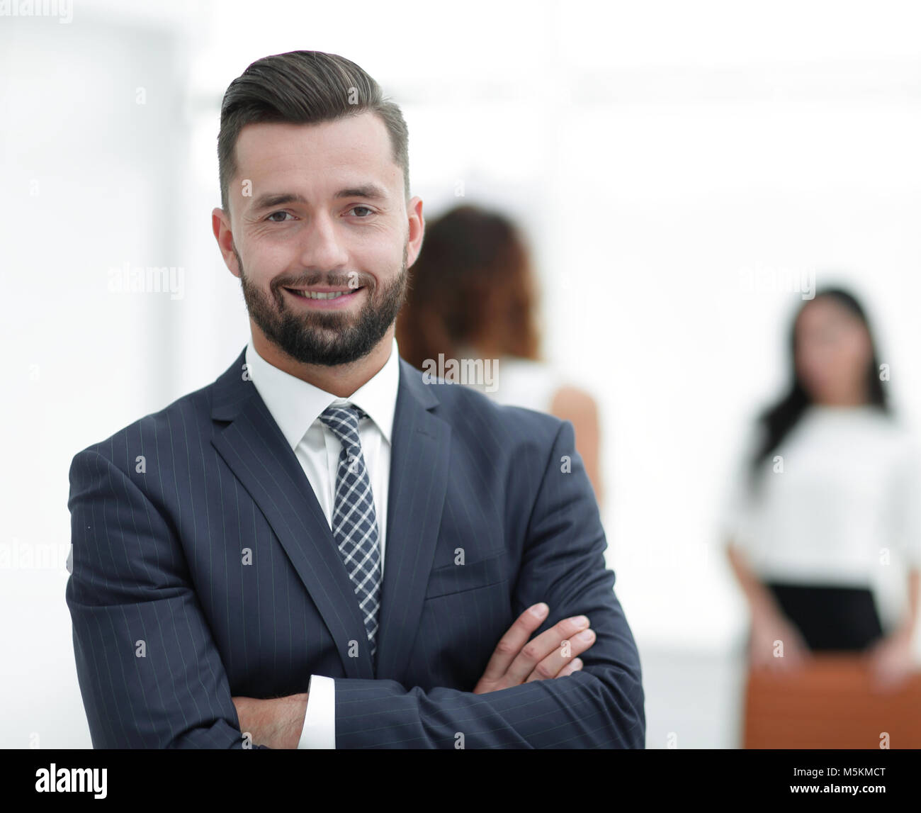 businessman on background of office Stock Photo - Alamy