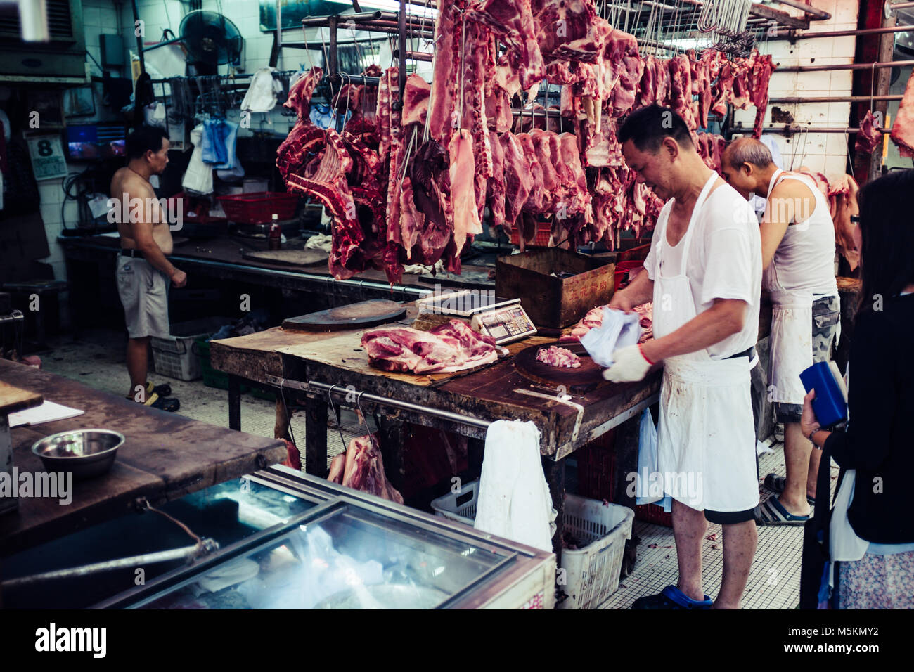 Man chopping meat at meat market hi-res stock photography and images ...