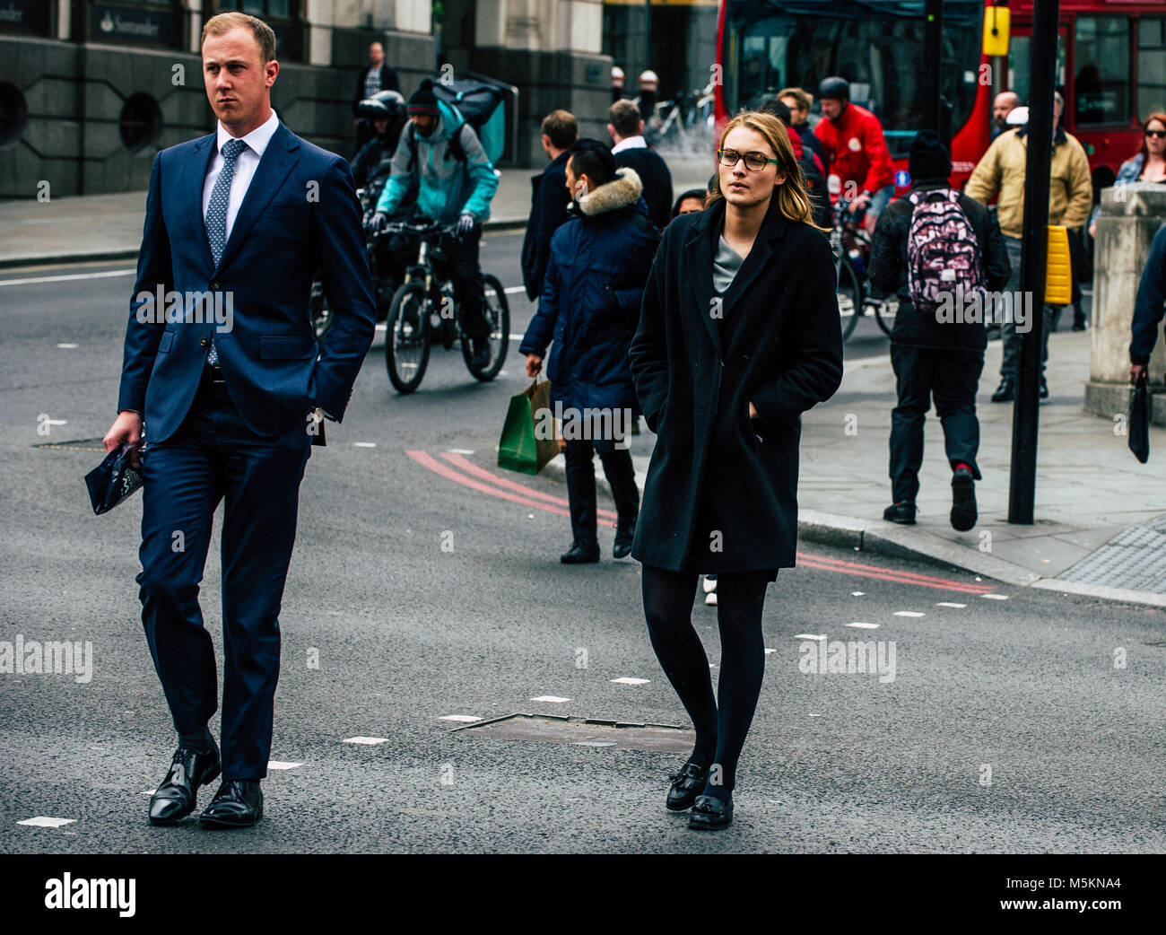 Commuters walking from bus stop hi-res stock photography and images - Alamy