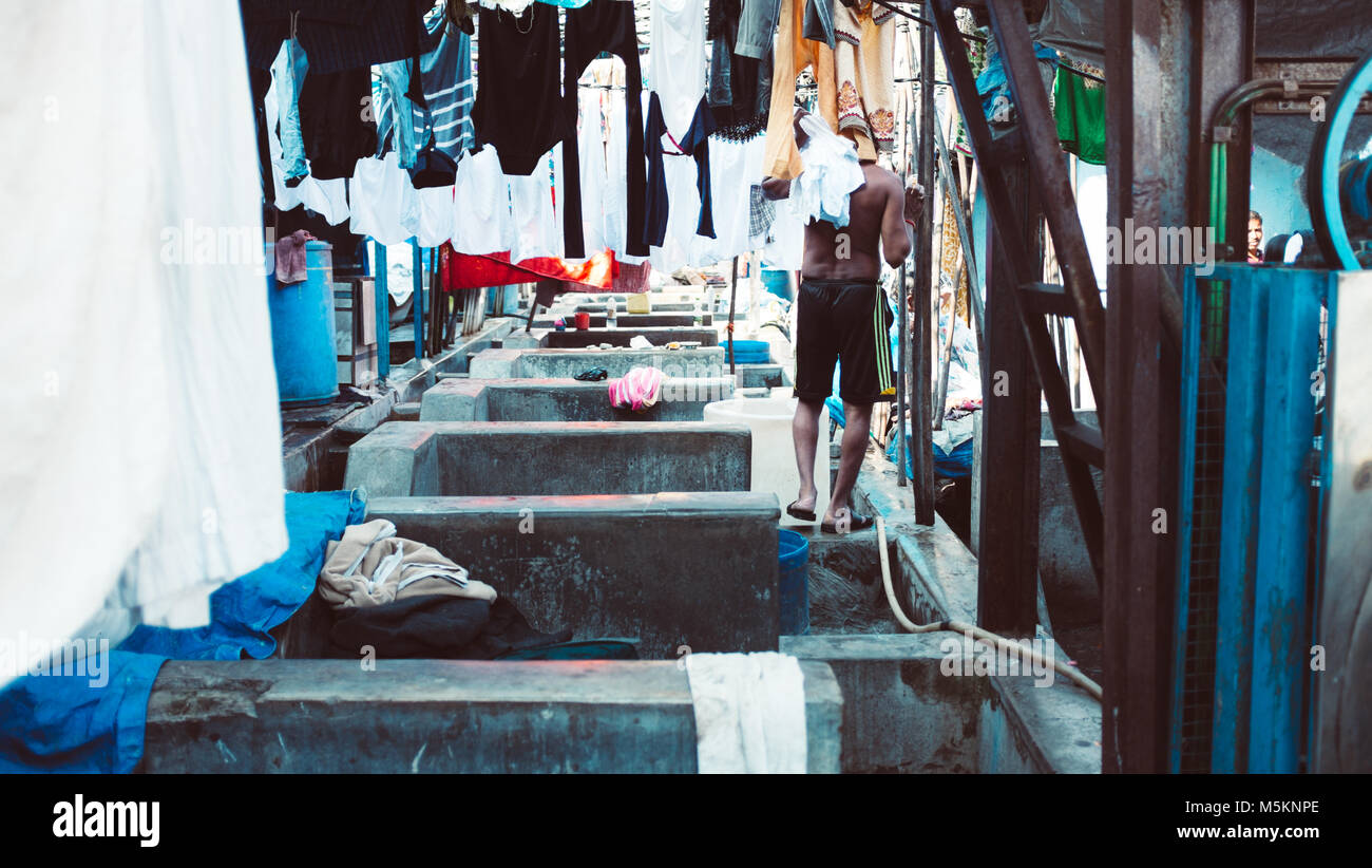 Indian man washing clothes hi-res stock photography and images - Alamy