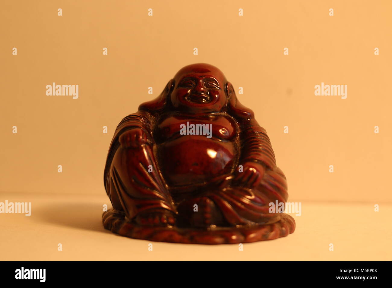 Red stone Chinese Buddha Stock Photo - Alamy