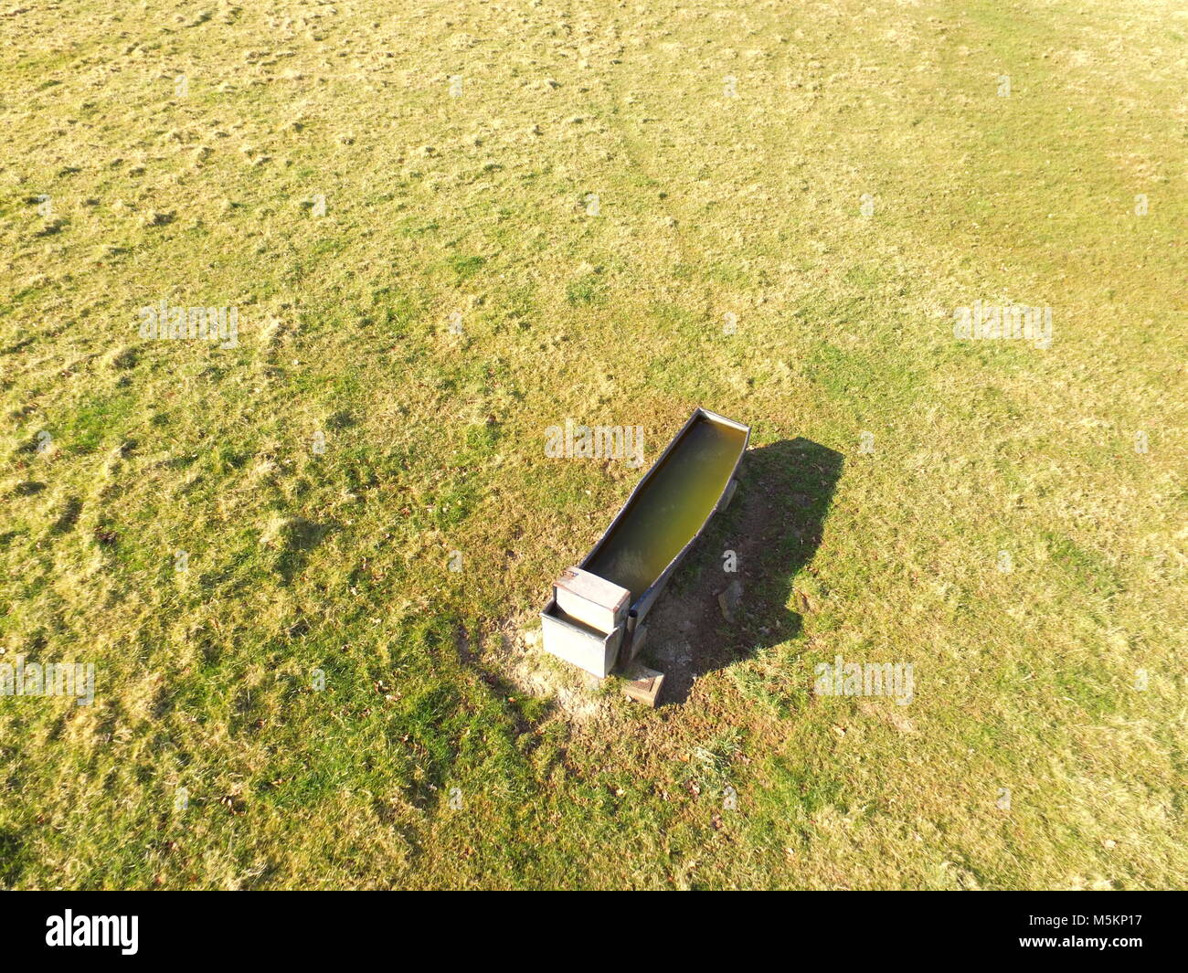 Aerial above view of a livestock water trough in a farm field Stock ...