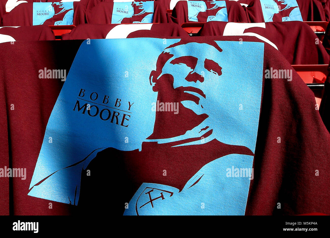 T-shirts are displayed in the stands to commemorate the 25th ...