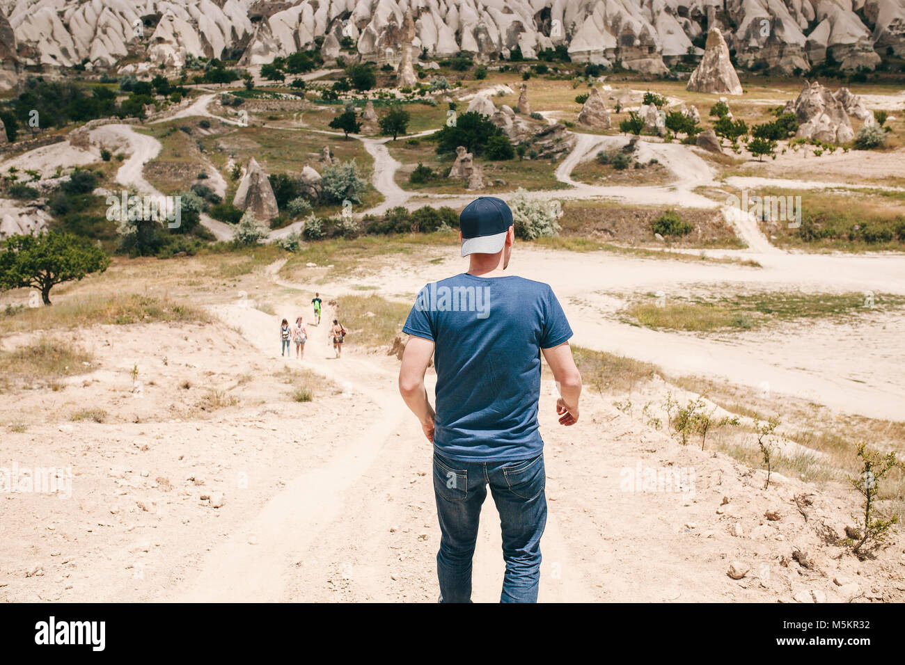 The tourist guy is trying to catch up with his friends of tourists on ...