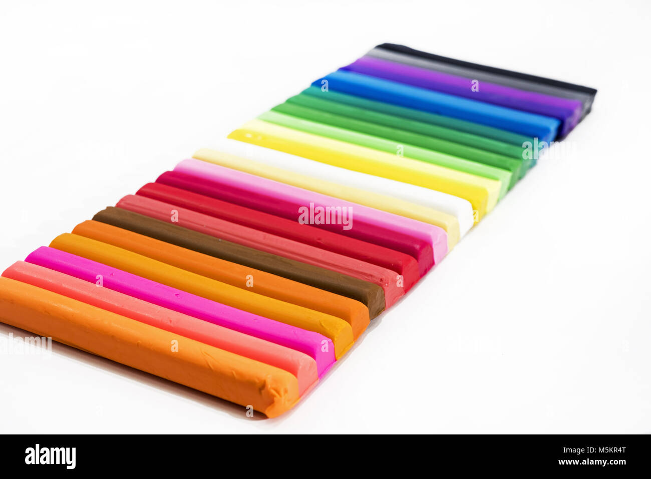 Color pieces of plasticine isolated on white background Stock Photo - Alamy
