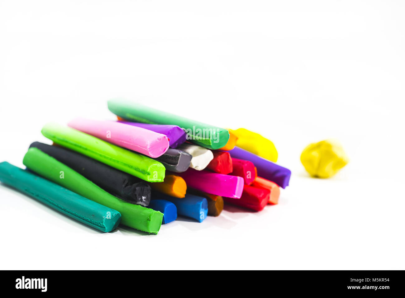 Color pieces of plasticine isolated on white background Stock Photo - Alamy