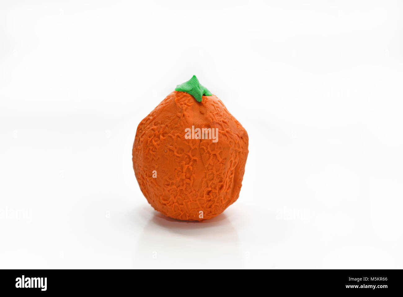 Orange from play clay. Isolated on white background Stock Photo - Alamy